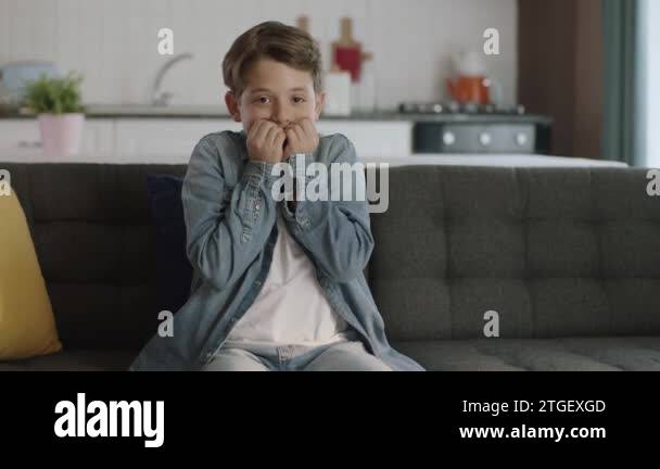 Portrait of a sad worried boy bored at home.A scared, bored, worried ...