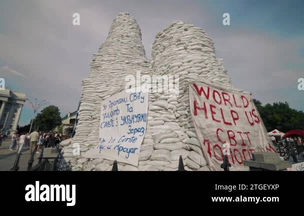 monuments protected by sandbags of Mikhailivska Square. Russian burned ...