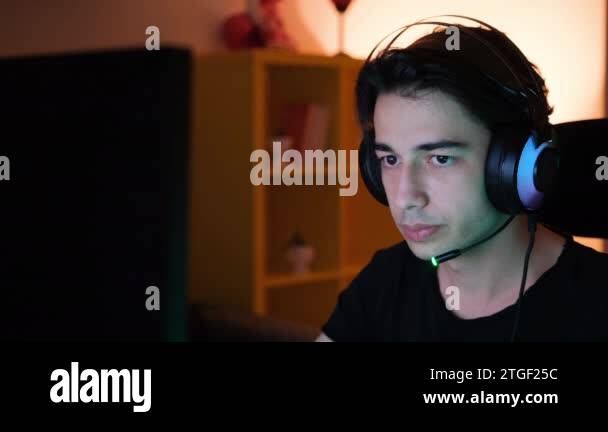 Young hacker, young hacker focused to computer screen. Close up footage ...