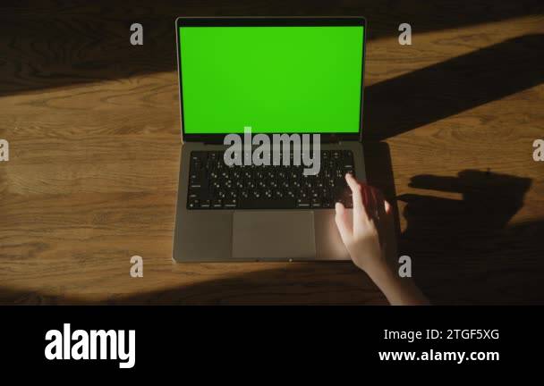 Top view of a caucasian woman hand entering frame and pressing enter on ...