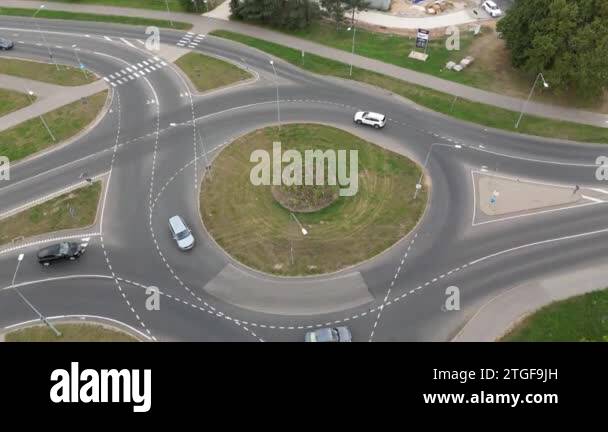 Top view of car traffic at roundabout lane. Traffic circle with a lot ...