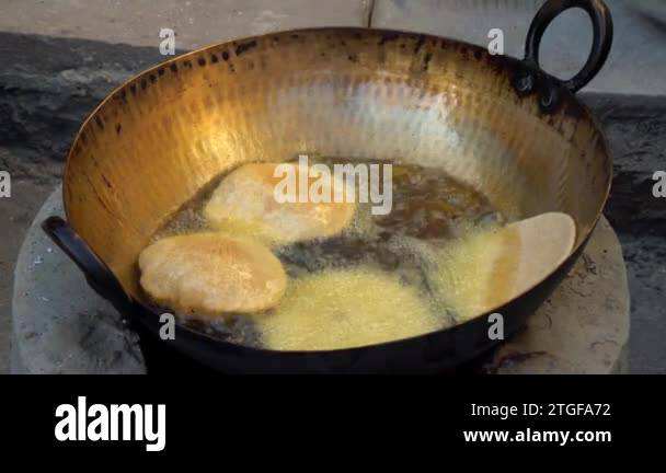 Making of delicious Bengali Luchi (deep fried bread). This is another ...