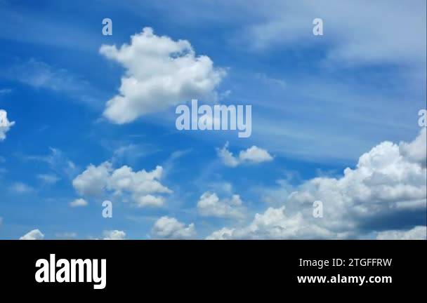 Blue sky white clouds. Puffy fluffy white clouds. Cumulus cloud cloudscape timelapse. Summer ...