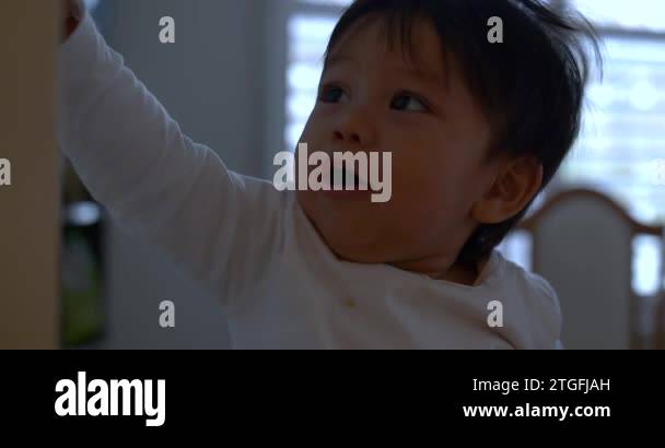 cute baby boy playing with a light switch turning it off and on ...