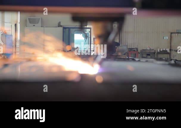 A plasma cutter making patterns from the metal sheet. The cutter ...