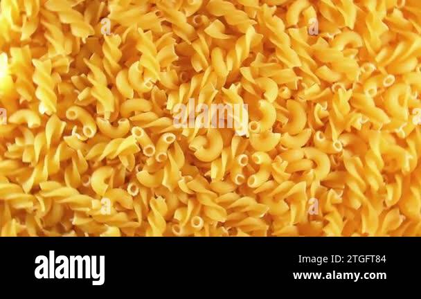Uncooked Fusilli and Chifferi Rigati Pasta - Top View. Fat and ...