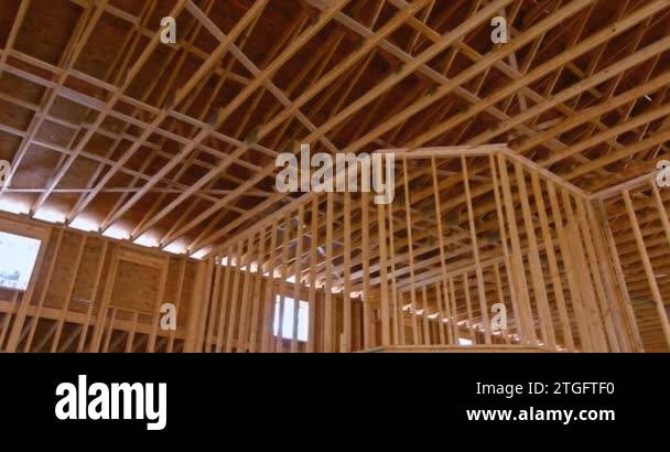 The inside view of new wooden building shows a wood beam framework ...