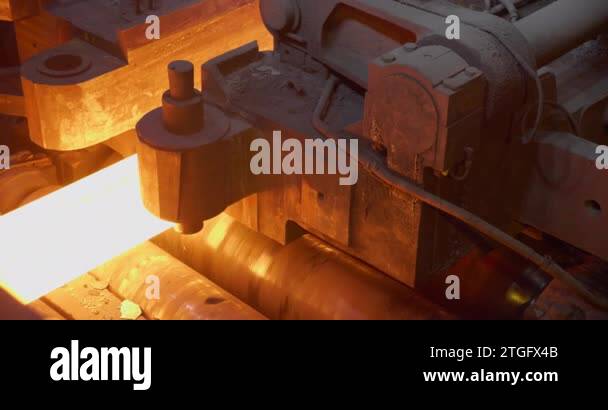 Rolling metal in production, moving on a hot metal ribbon, ball ...