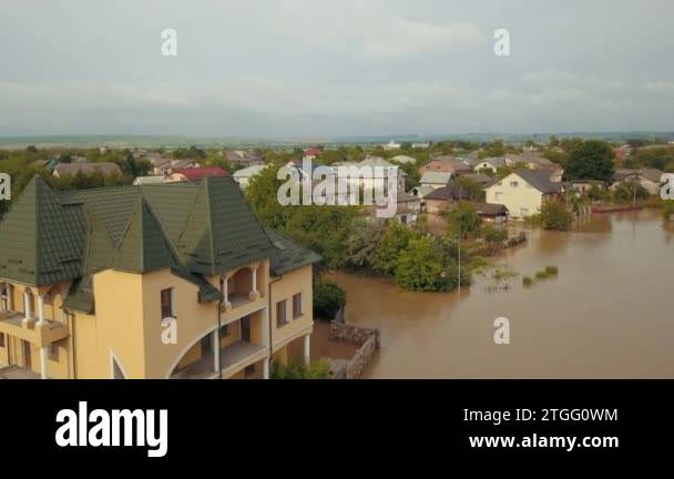 Flooded city, heavy rains, stagnant water. House on street of city ...