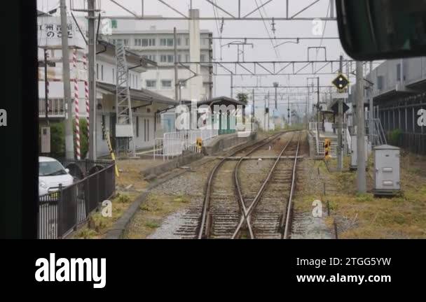 Japanese local train arriving in countryside of Shiga, Toyosato Station ...