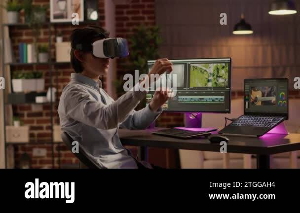 Videographer using editing software and vr glasses to create montage ...