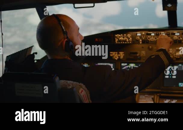 Airline captain fixing altitude and longitude to fly airplane, using ... Airline captain fixing altitude and longitude to fly airplane, using ...