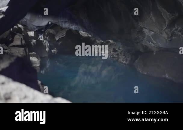 View of Grjotagja Volcanic Cave With Clear Blue Hot Thermal Water Near ...