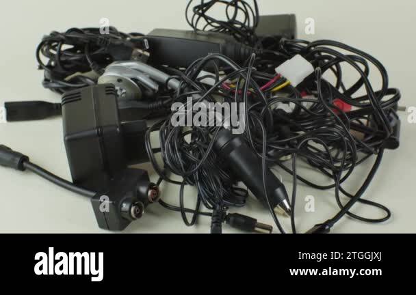 Bunch of old wires, connections and chargers for modern devices close ...