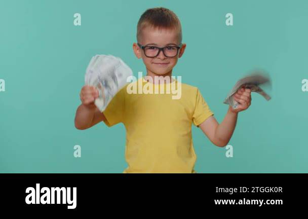 Little toddler children boy holding fan of cash money dollar banknotes ...