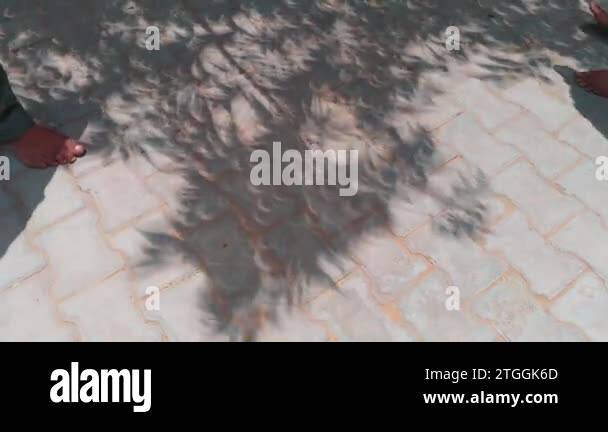 Shadow of solar eclipse on concrete wall, solar eclipse shape spots of ...