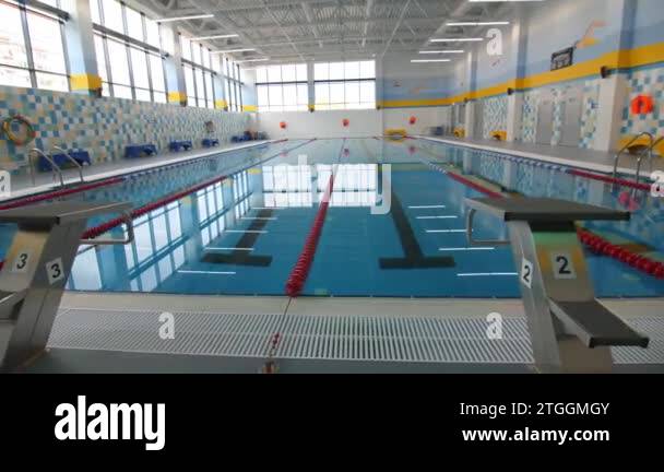 Large swimming pool with clear water separators and ramps in spacious ...