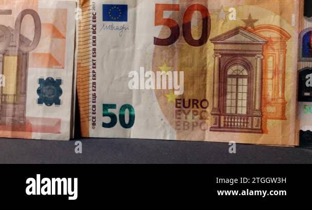 Fifty Euro banknotes, new and old design of 50 Euro bills. Piled up ...