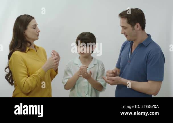 Happy family on a white background. Little girl is playing rock ...