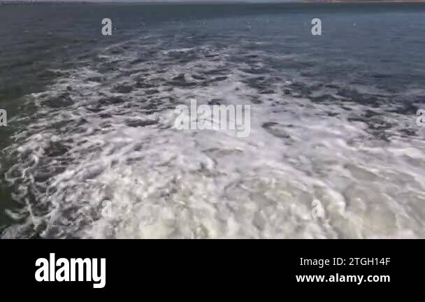 Water pollution. Dirty water from treatment plants flows through a pipe ...