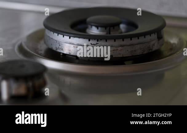 Fire in the gas burner is lit in slowmo. The flame of an electric ...