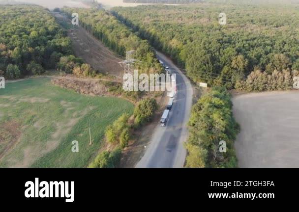 grain delivery. Aerial view. Grain storage. Grain trucks stand along ...