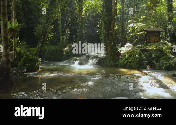 Beautiful scenery of a cascade with water stream flowing over the rocks ...