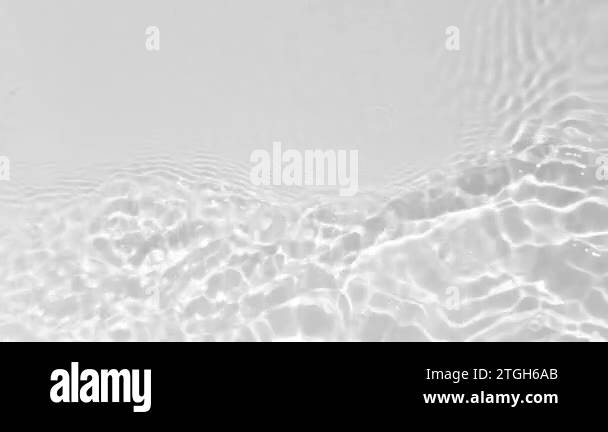 Close up view on Water texture with waves and light reflections. Water ...