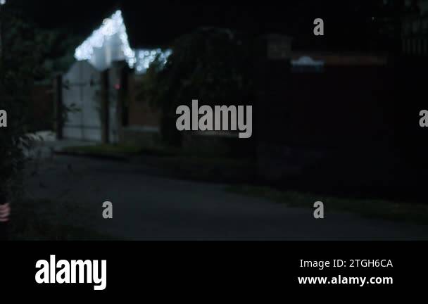 Thief in a mask carries a stolen TV late at night, is caught by the ...