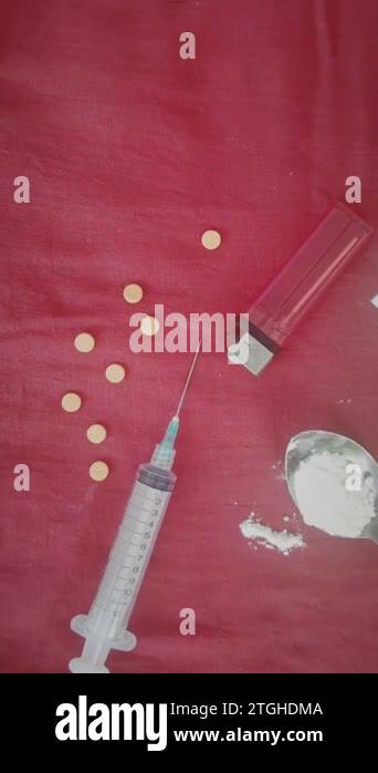 Video of injection, spoon, drugs, lighter and methamphetamine on red ...