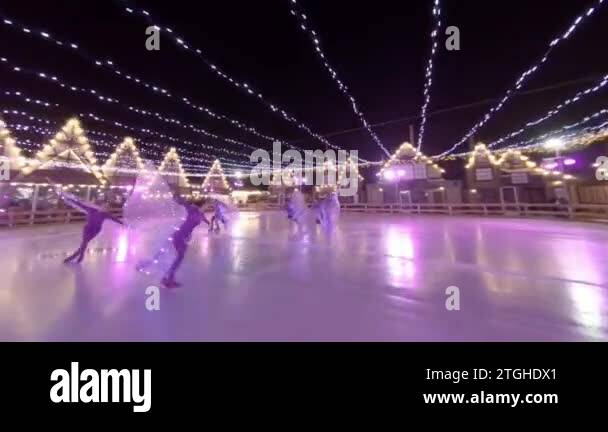 shot of dancers on the ice performing fairy-tale personages and doing ...