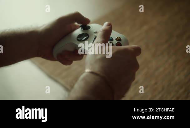 Child gamer hands holding modern console for play station close-up, guy ...