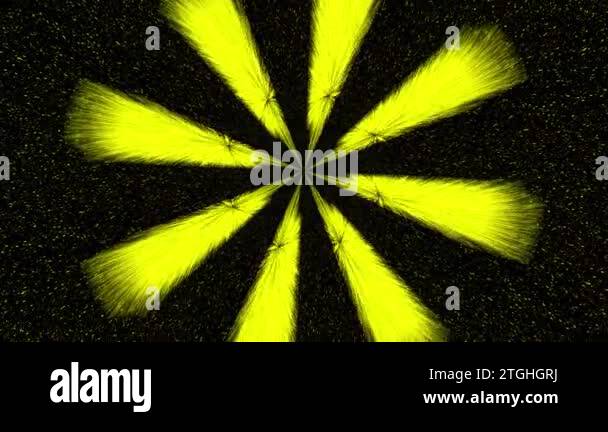 Yellow beams of light with flashes come out of the center of the frame ...