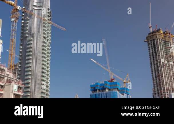 Cranes working on big constraction site works of new skyscrapers ...