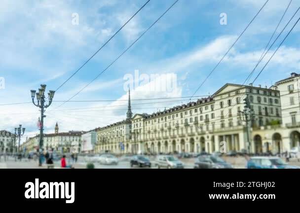 Historical buildings traffic and people crowd on busy central street of ...