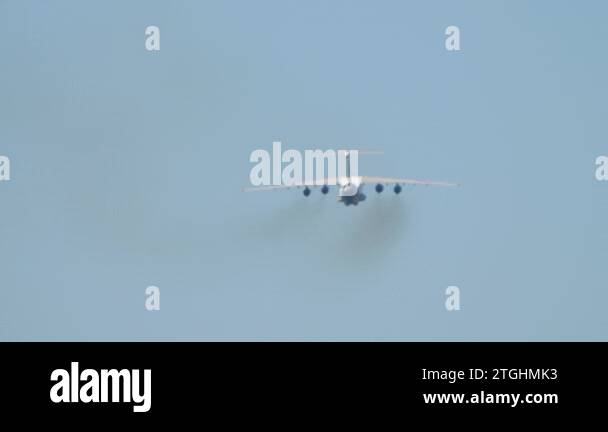 Transport heavy aircraft climb after takeoff, long shot rear view ...