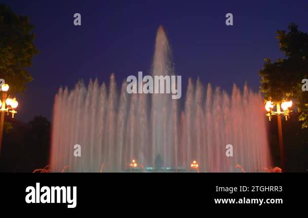 Magic singing magic fountains of Montjuic, people watch the performance ...