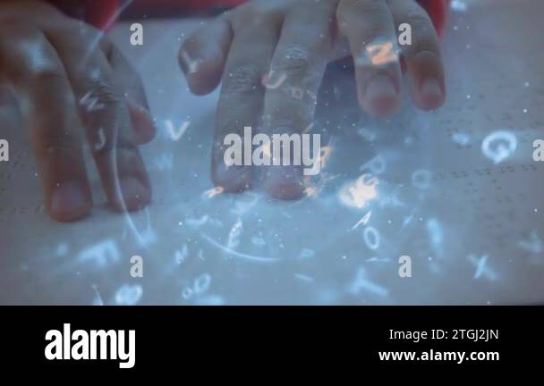 Alphabets floating and spinning against close up of hands reading a ...
