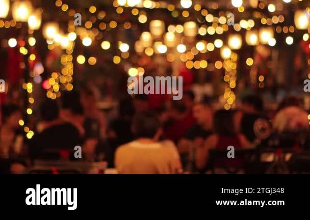 at the restaurant night time, many people in the restaurant eat and ...