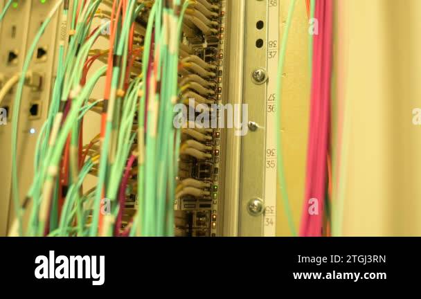 blinking LED lights in a server rack with RJ45 and fiber optic cable ...