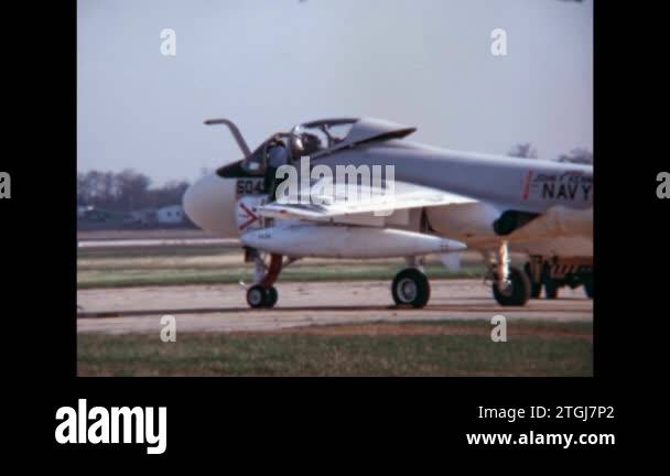 Mechanic assists military pilots of an American Cold War bomber jet ...