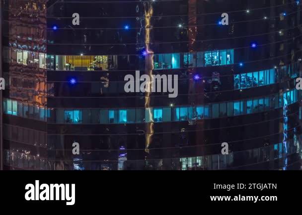 Office windows lights in modern tower buildings timelapse at night ...