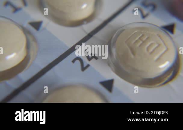 Concept of contraception and birth control. Maco shot of the spinning ...