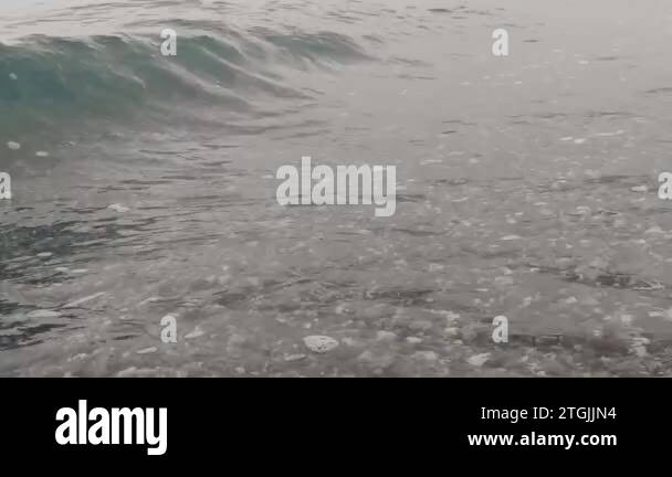 Slow motion of waves rushing towards the shore. As the waves move, they ...
