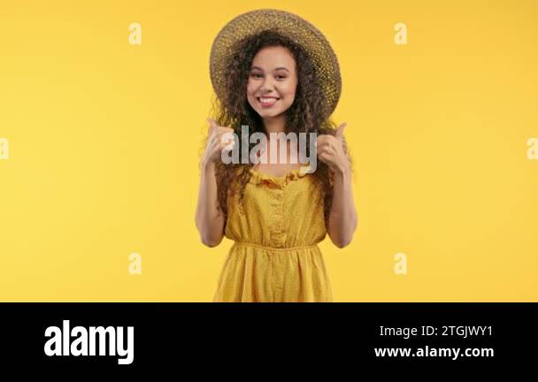 Positive sunny woman makes hand sign like, thumbs up gesture. Happy ...