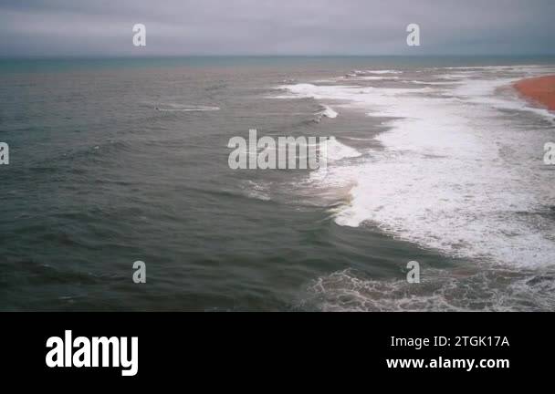 Huge waves at Nazare in Portugal where surfers are being towed in to ...