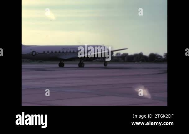 US Navy passenger plane with four radial piston engines and propellers ...