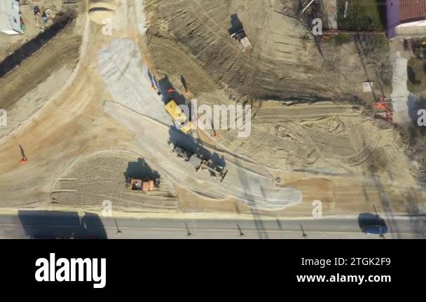 Above top view, dolly move overhead on workers as watering construction ... Above top view, dolly move overhead on workers as watering construction ...