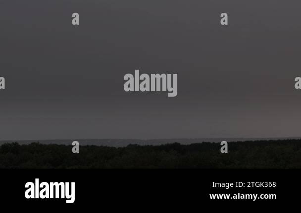 Lightning flash in storm clouds. Heavy clouds bring multiple flashes of ...