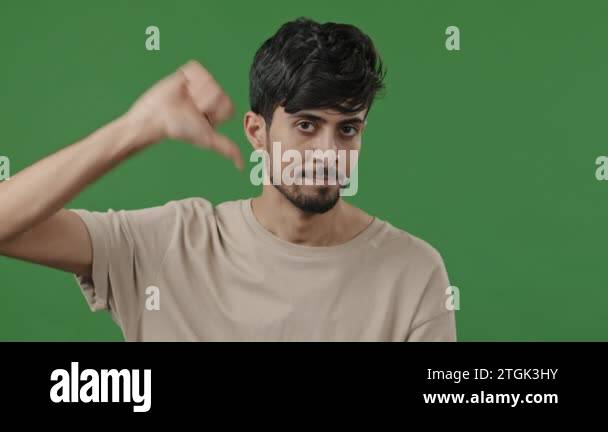 Unsatisfied man arab indian client showing thumb down negative attitude ...